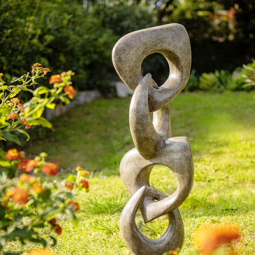 Multiple Rings - Sculptures. Bronze rings, black granite marble base ...