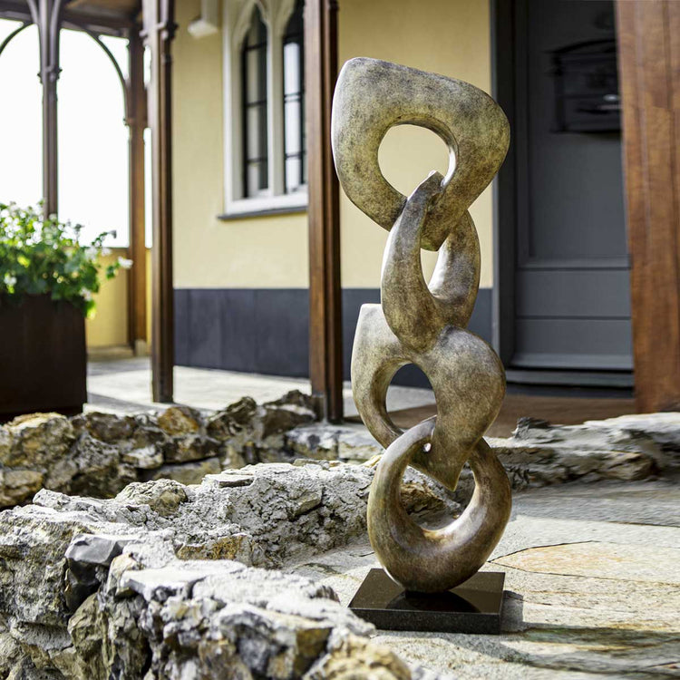 Multiple Rings - Sculptures. Bronze rings, black granite marble base ...